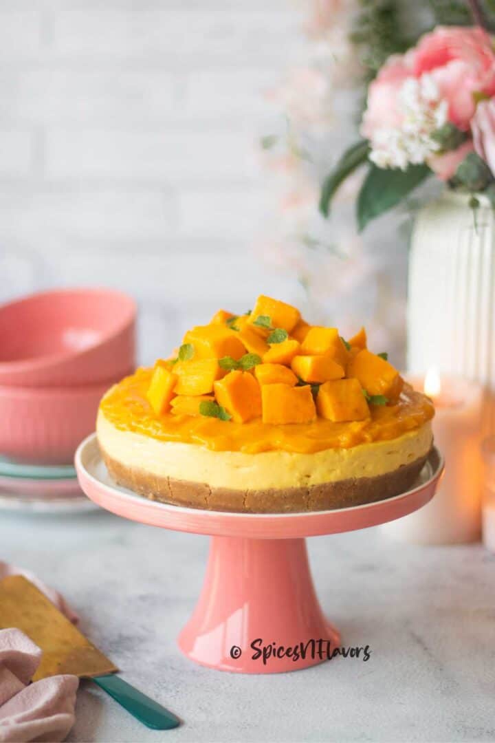 The Best Eggless Baked Mango Cheesecake recipe - Spices N Flavors