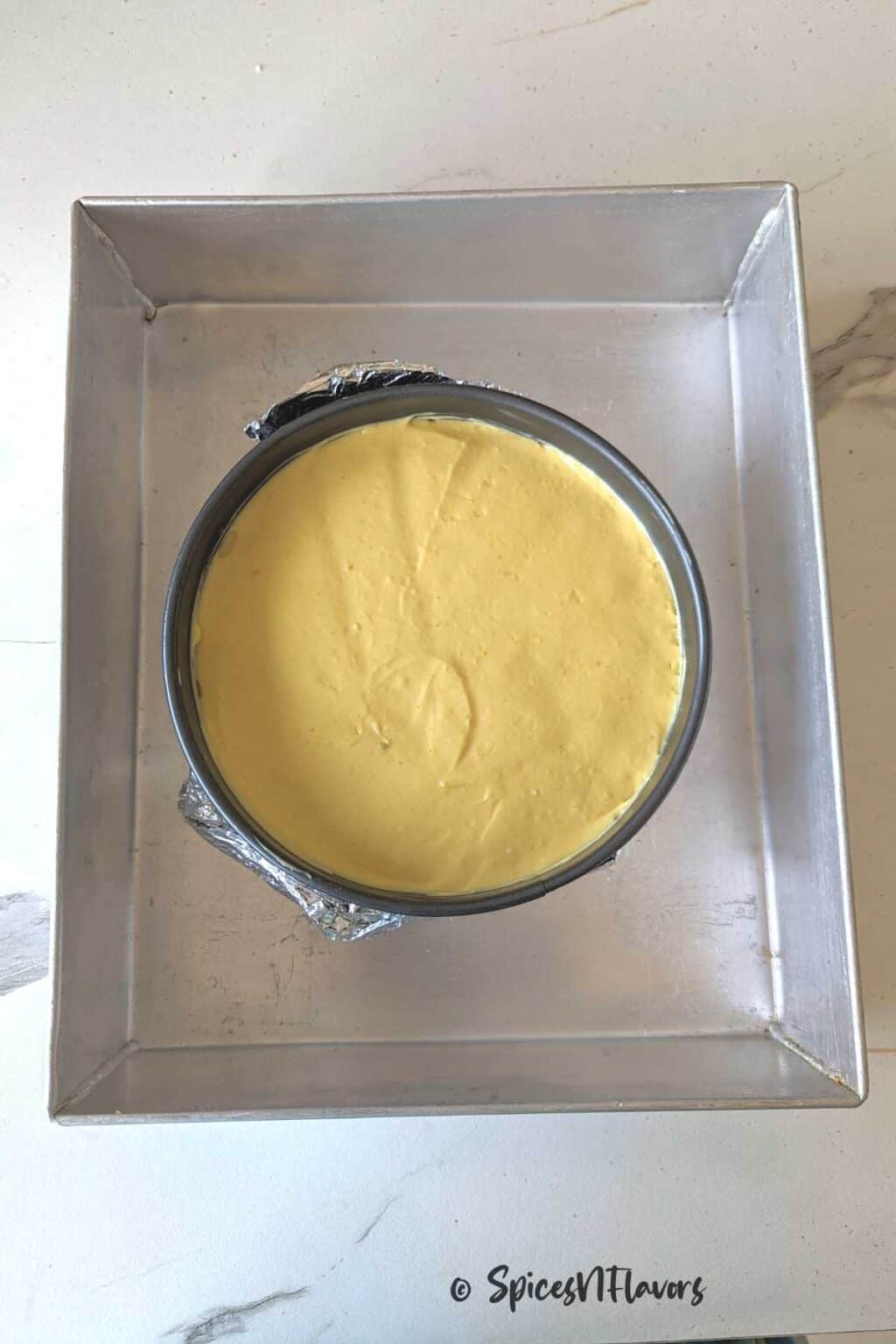 The Best Eggless Baked Mango Cheesecake recipe - Spices N Flavors