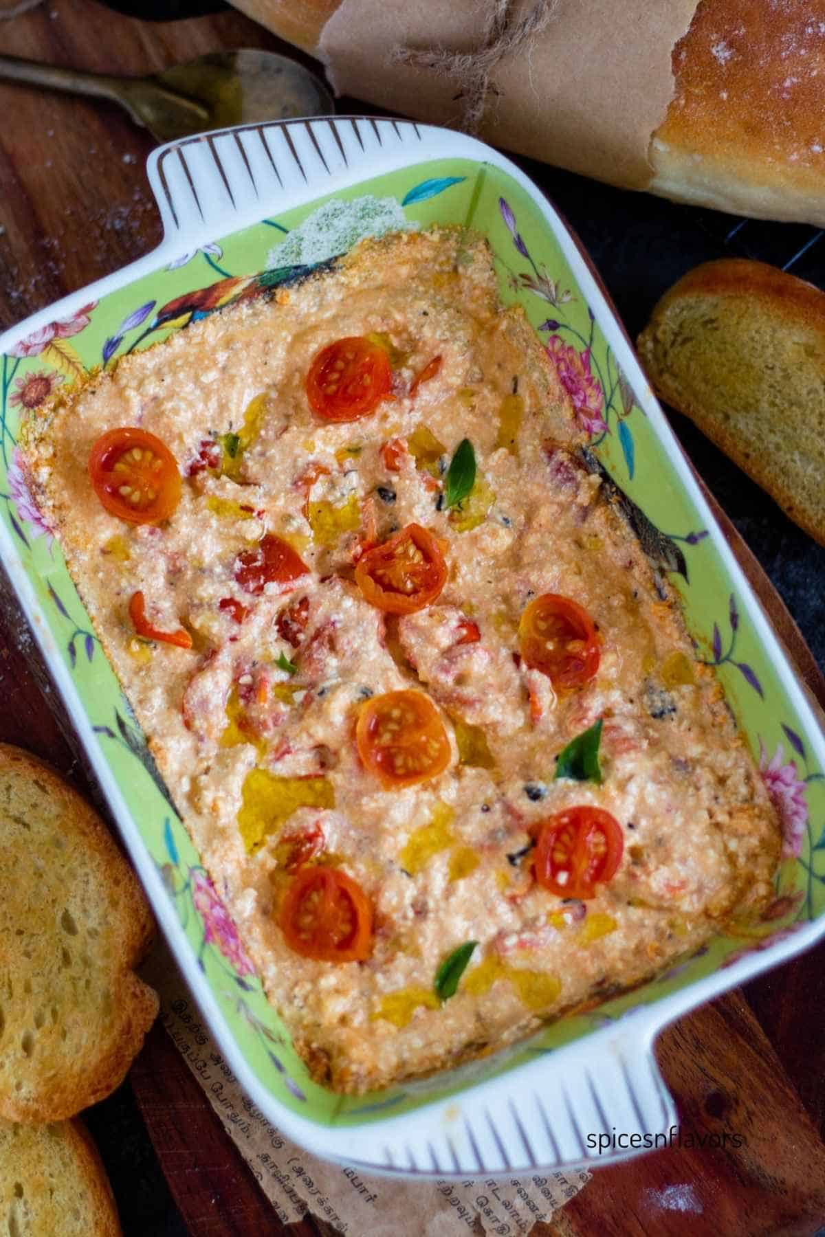 Homemade Baked Feta Dip recipe with cherry tomatoes - Spices N Flavors